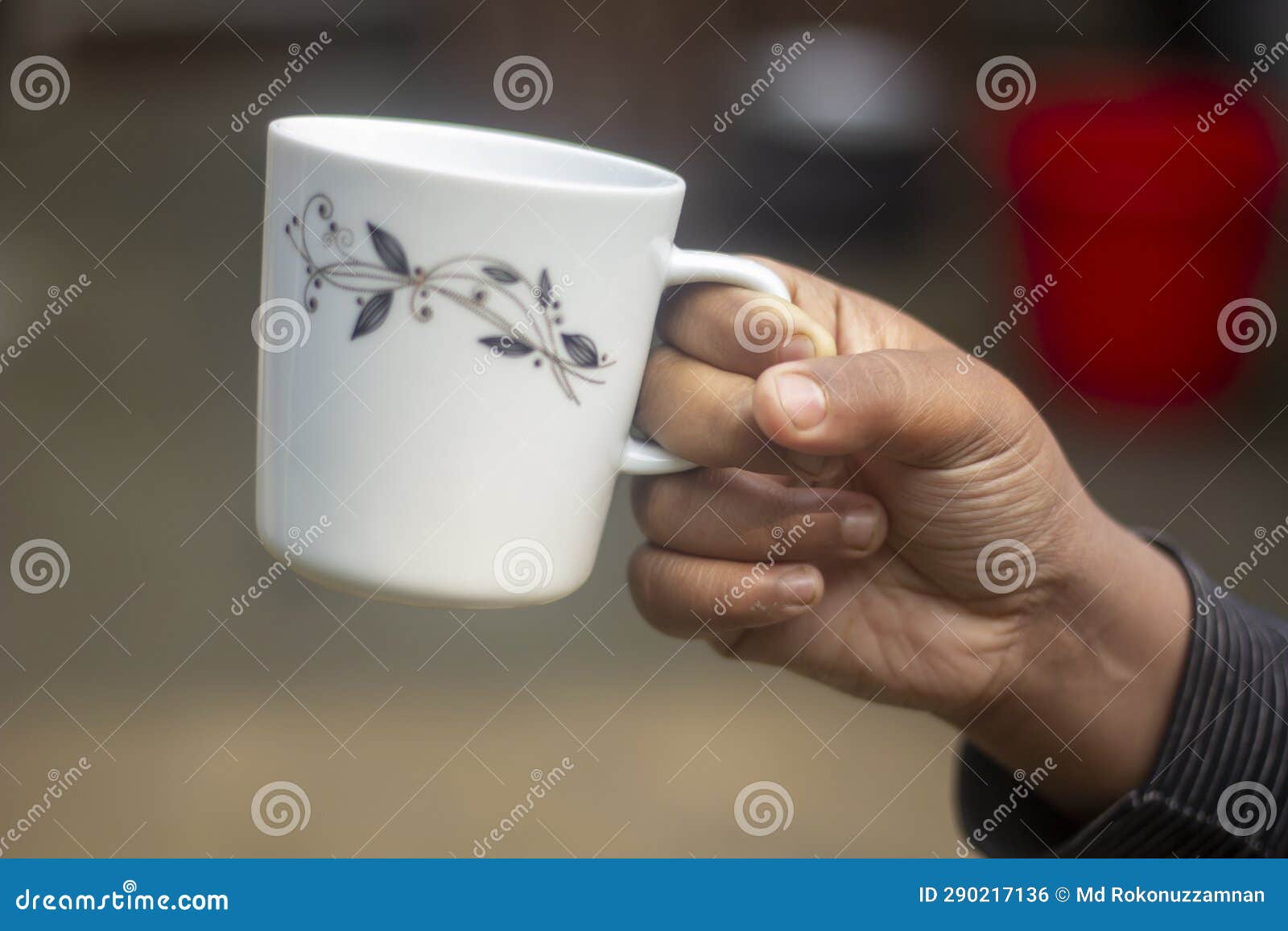 A Human Hand Holds an Old Tea Cup and the Background Blur Stock Photo ...