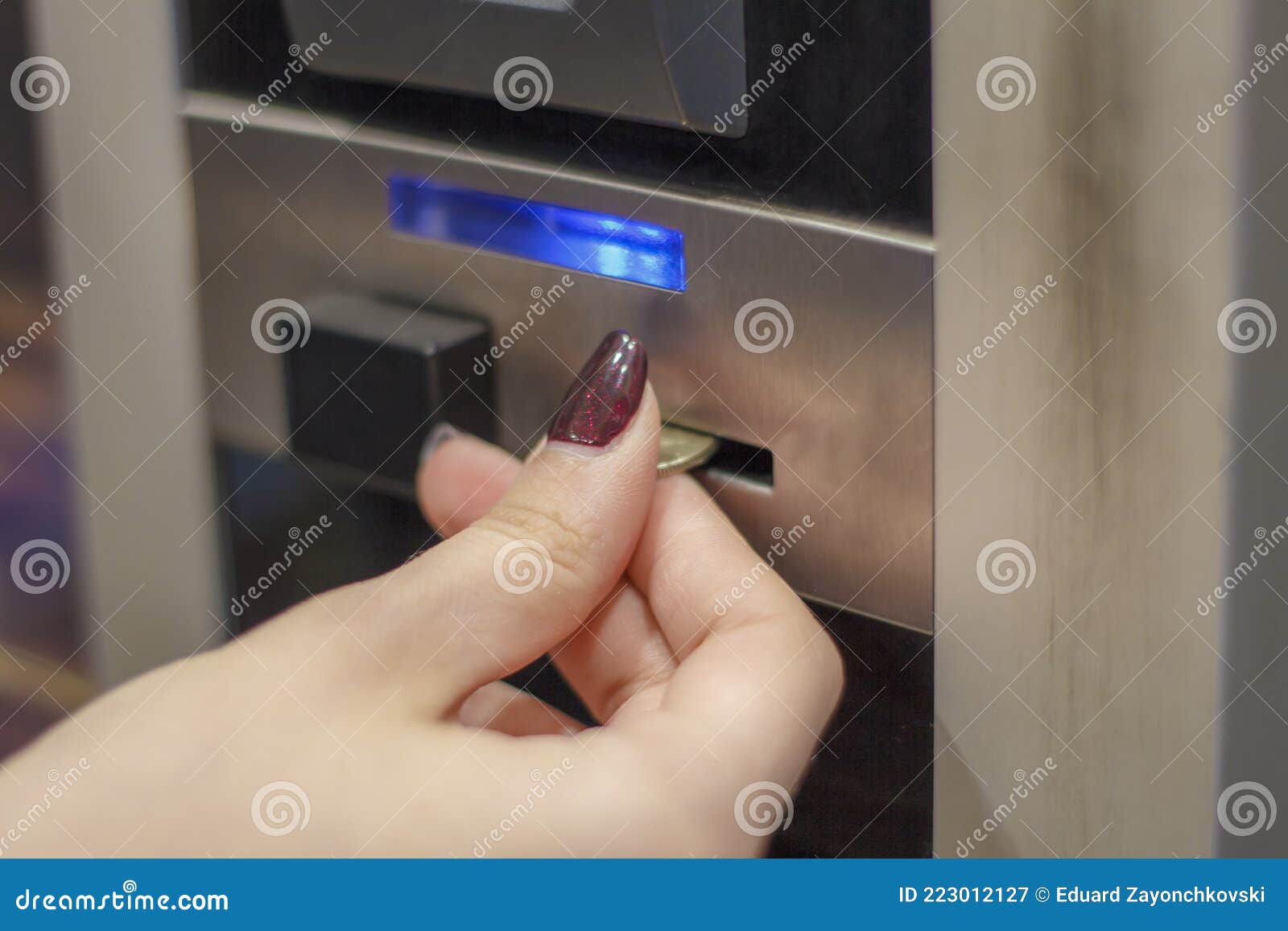 Human Hand Inserting a Coin in a Vending Machine. Stock Image - Image ...