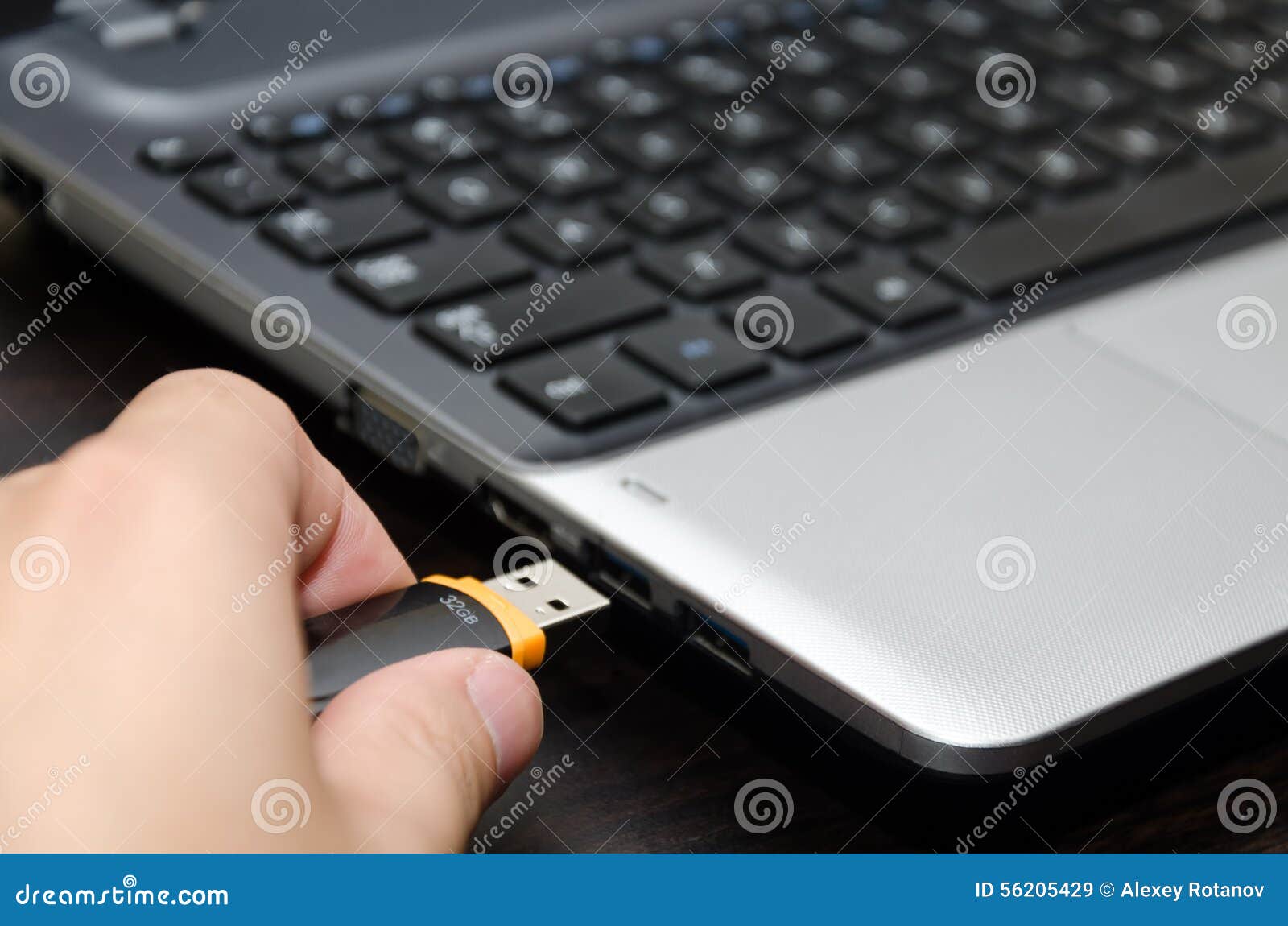 Human Hand Inserting USB Flash Drive into Laptop Computer Close Up ...
