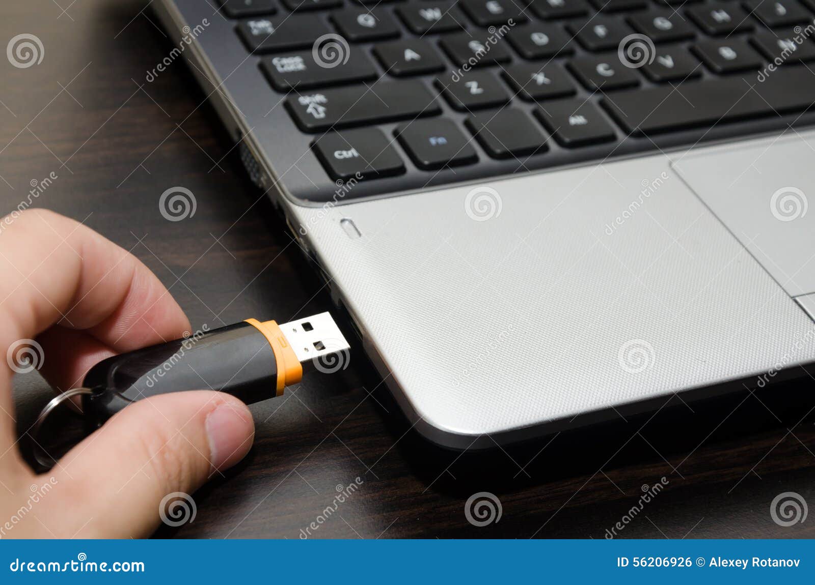 Human Hand Inserting USB Flash Drive into Laptop Computer Close Up ...