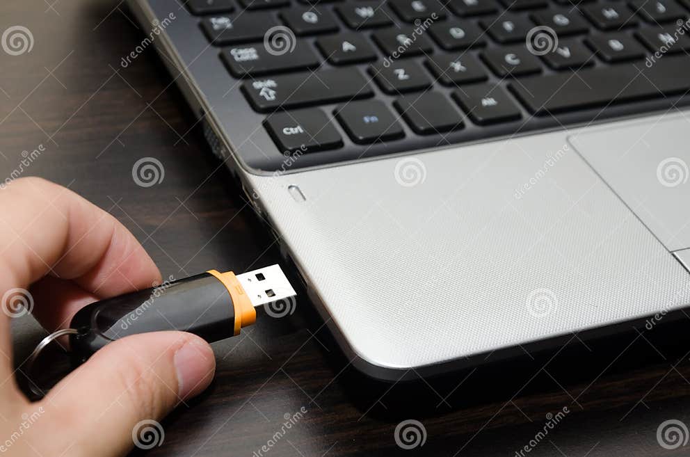 Human Hand Inserting USB Flash Drive into Laptop Computer Close Up ...