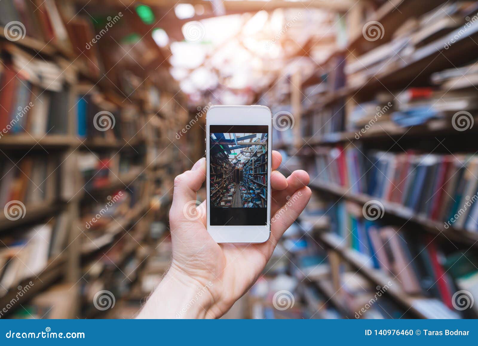 Human Hand Makes a Photograph of a Public Library on a Smartphone ...