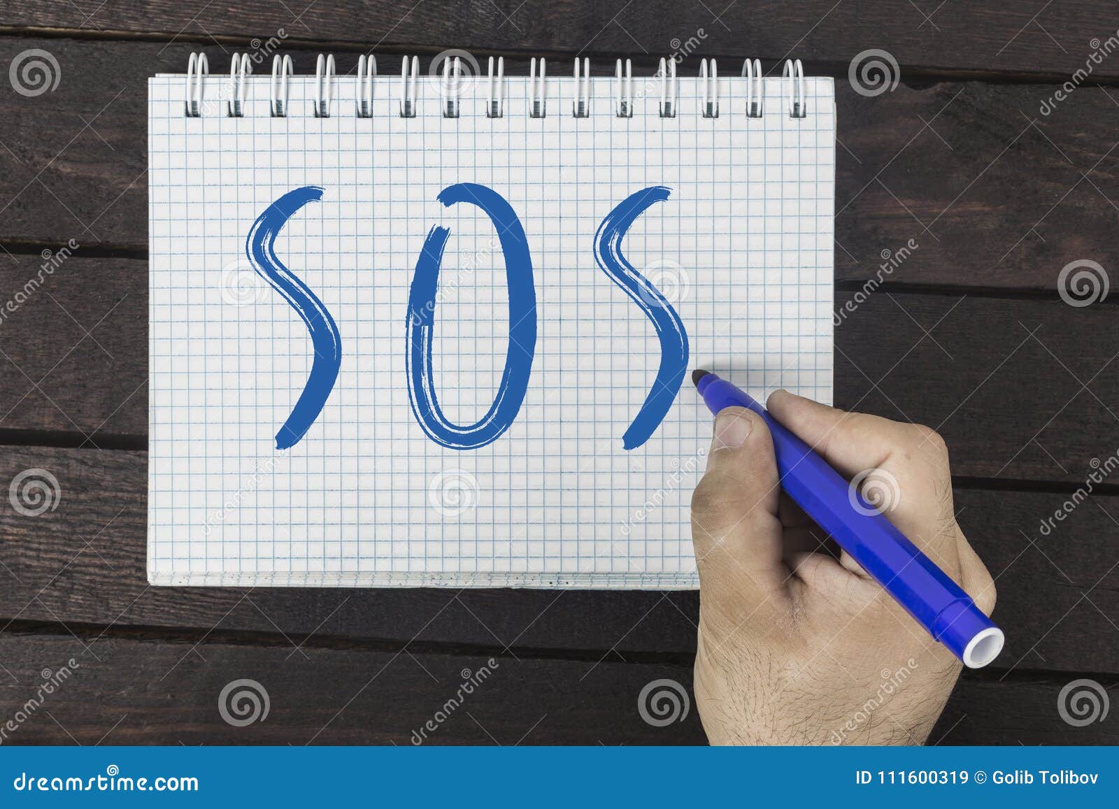 Human Hand with Marker Writing Text on Notepad: SOS Stock Image - Image ...