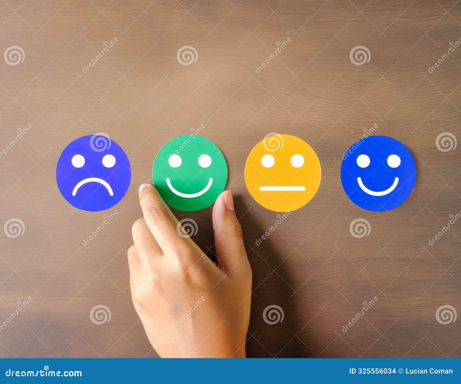 Human Hand Moving Round Cut Smiley Faces on a Table Surface Top View ...