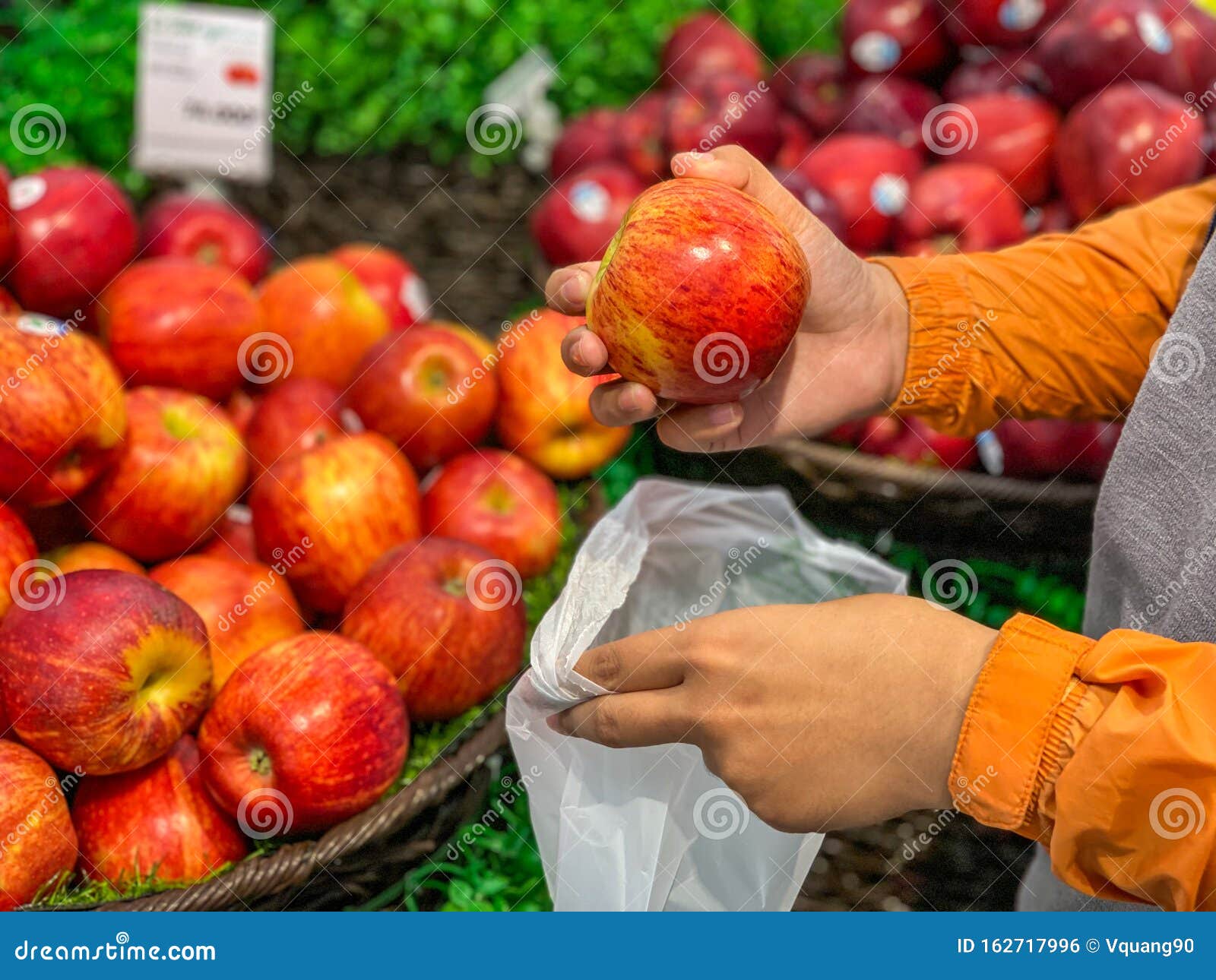 Human Hand Picking an Apple and Using Bio-plastic Bag Stock Photo ...