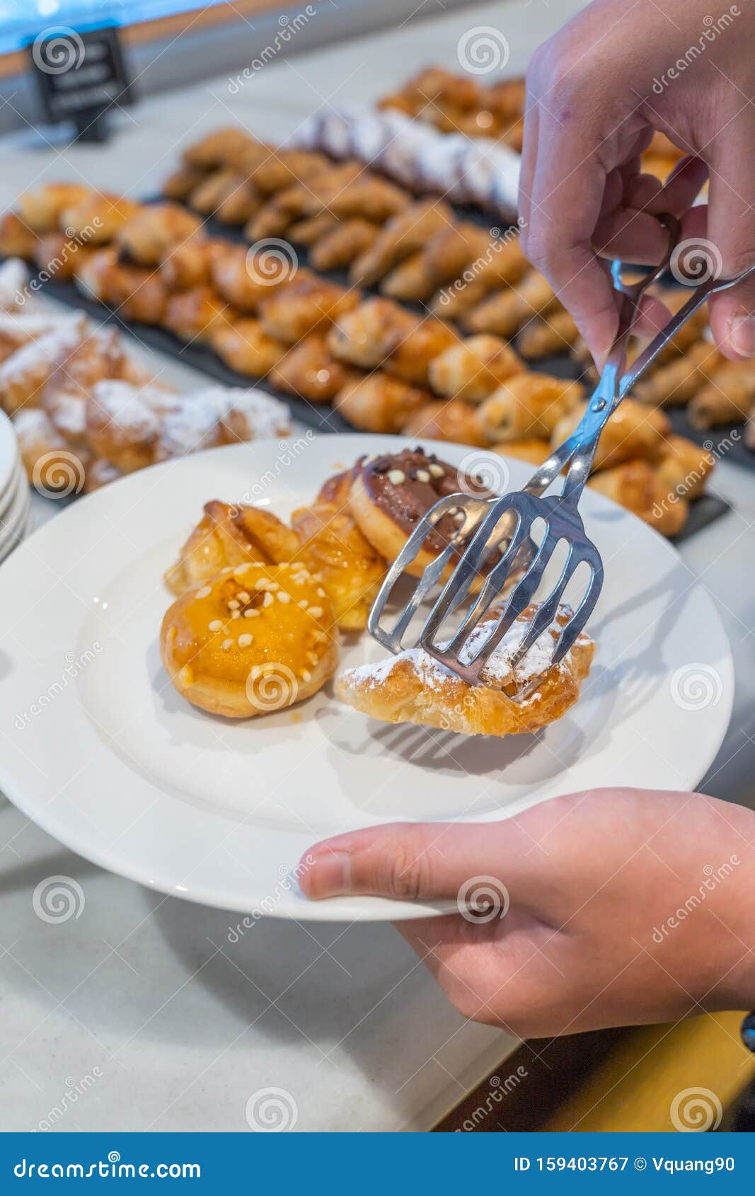 Closeup Shot of Human Hand Picking Assorted Pastry at Buffet Stock ...