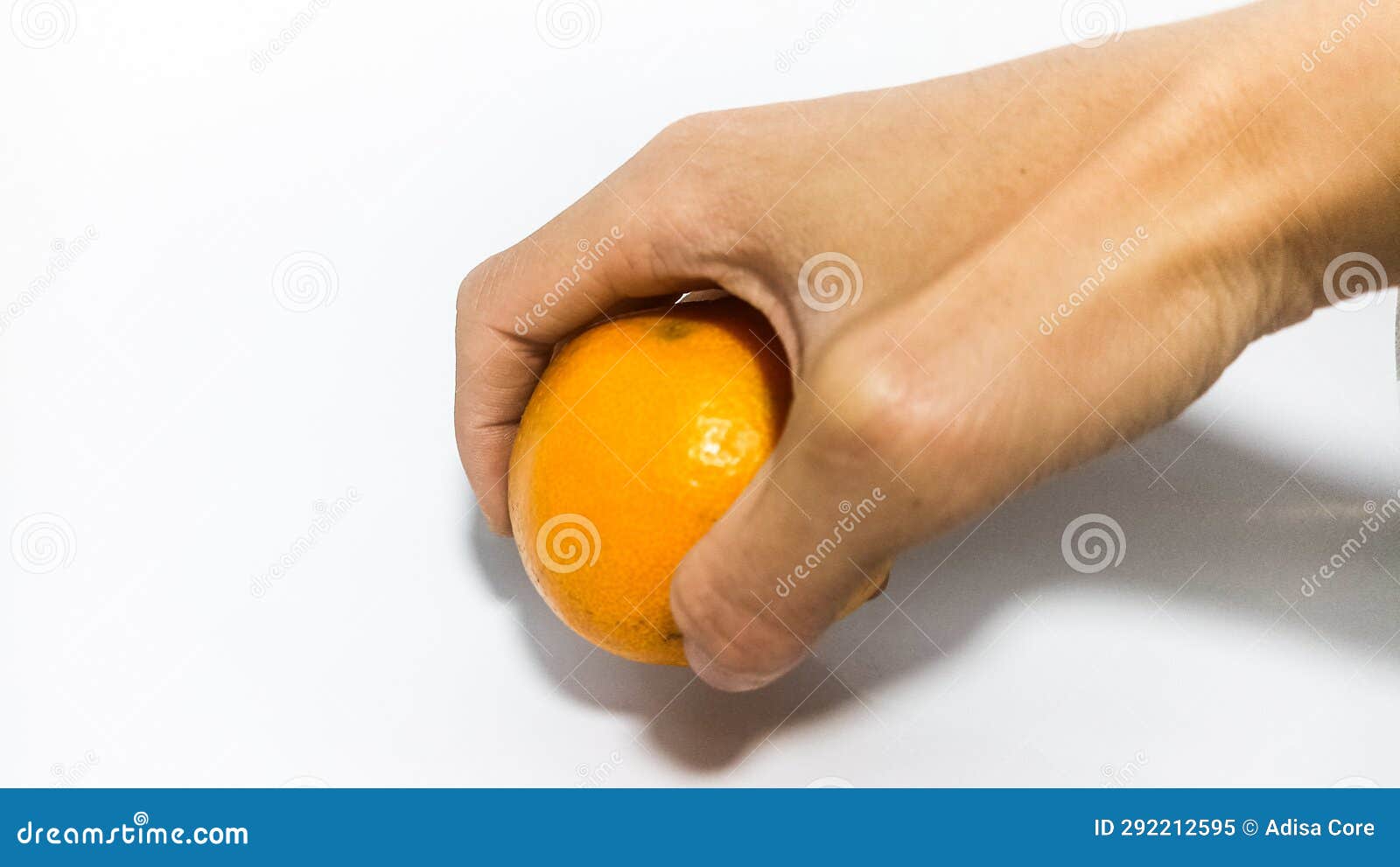Human Hand is Picking Up Orange Fruit on an White Background in Eye ...