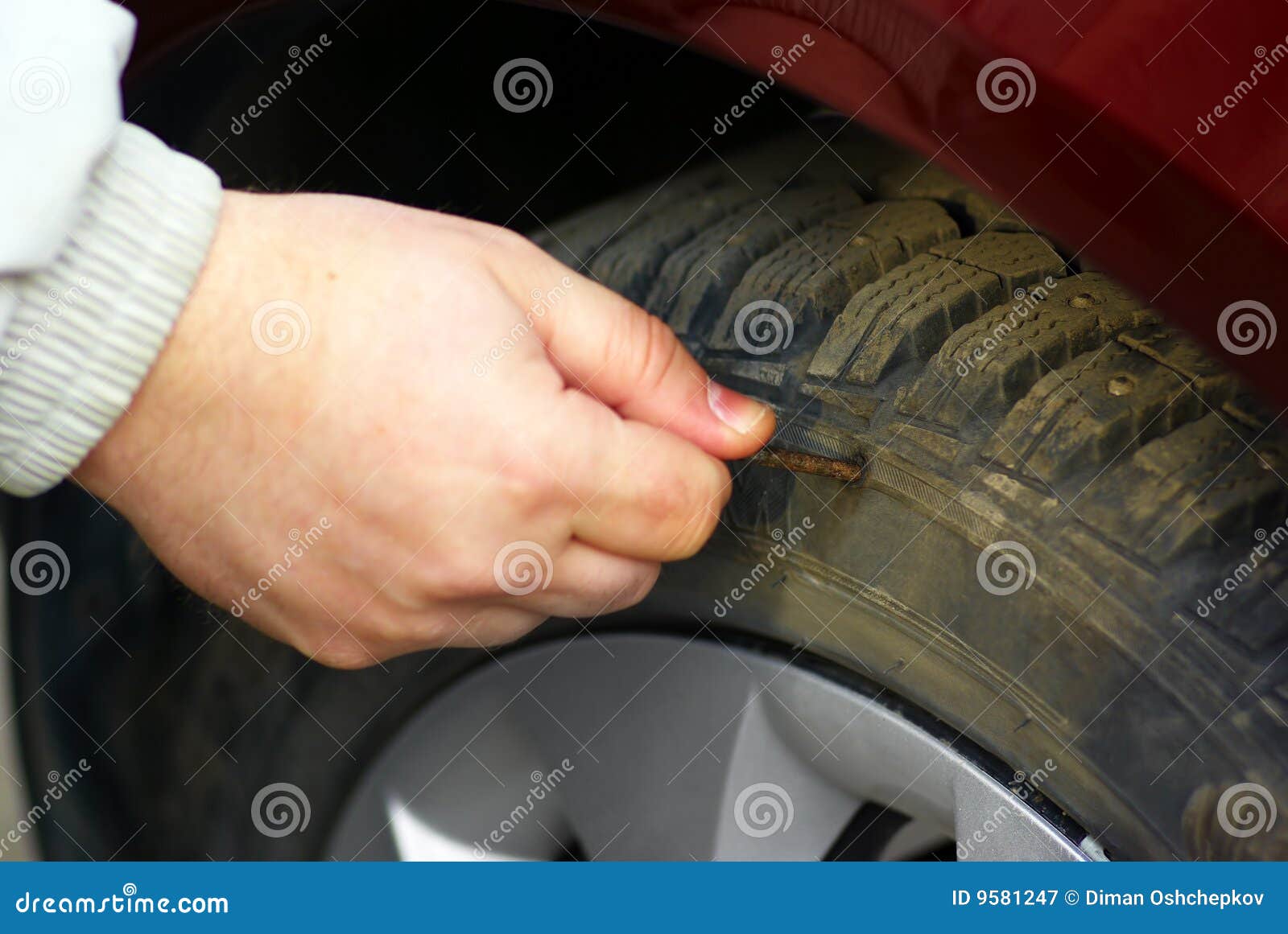 Human Hand Piercing the Tire Wheel Stock Image - Image of close, person ...