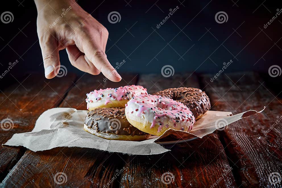 Human Hand Pointing at Donut on the Table Stock Photo - Image of ...