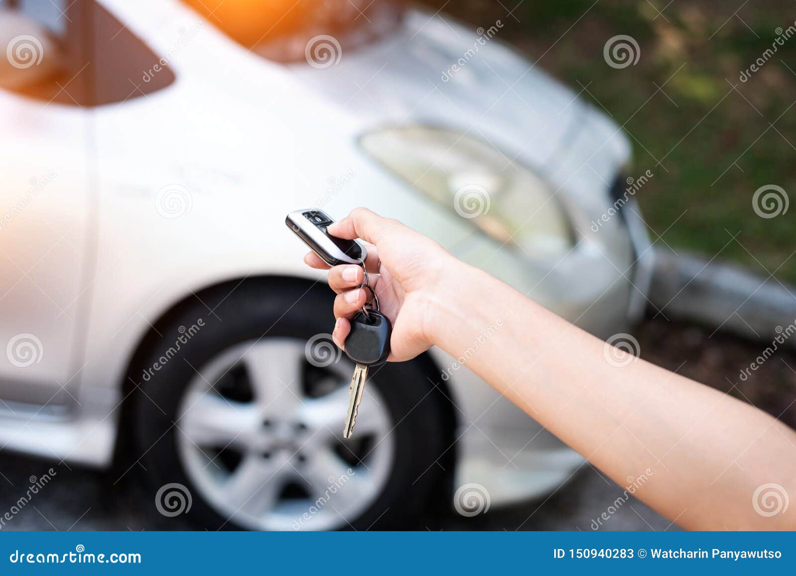 The Human Hand is Pressing Button on Car Remote Control Key,for Open ...