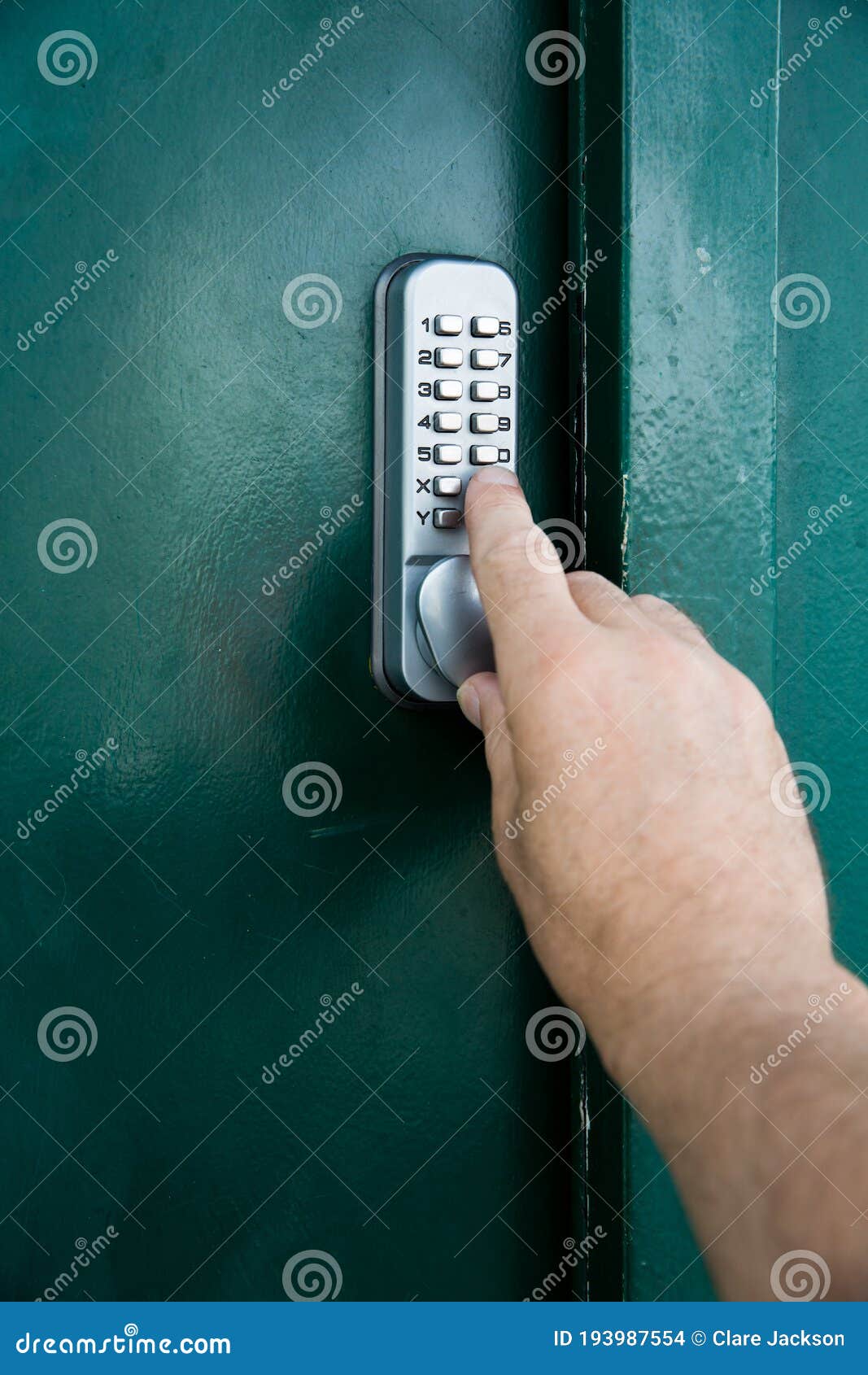 A Human Hand Pressing the Buttons on a Combination Lock To Gain Entry ...