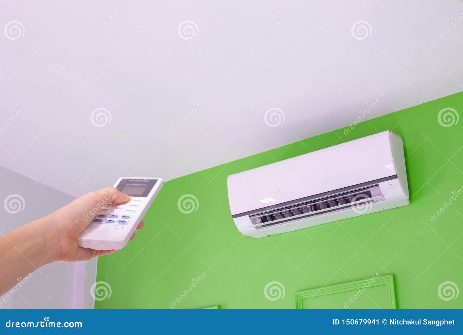 Human Hand Pressing on Remote Control for Switch on Air Conditioner ...