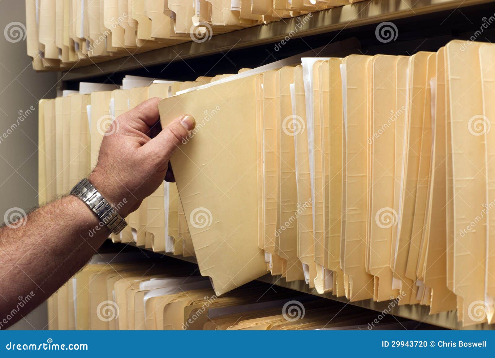 Hand Pulls File Folder Paperwork from Shelf Stock Photo - Image of ...