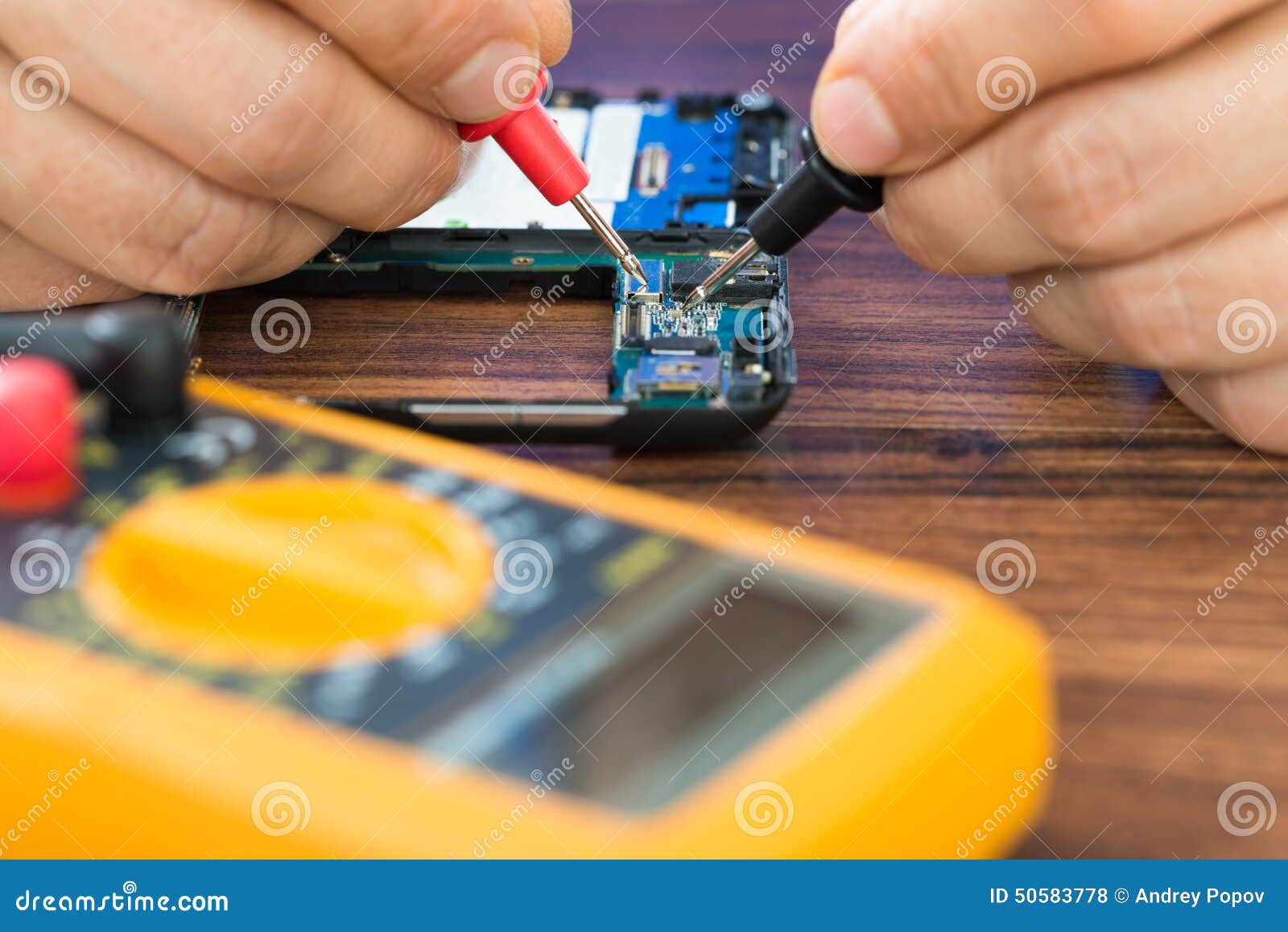 Human Hand Repairing Cellphone with Multimeter Stock Photo - Image of ...