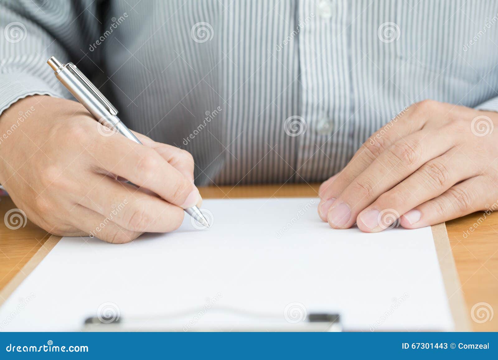 Human Hand Signing White Paper on Wood Table Stock Image - Image of ...