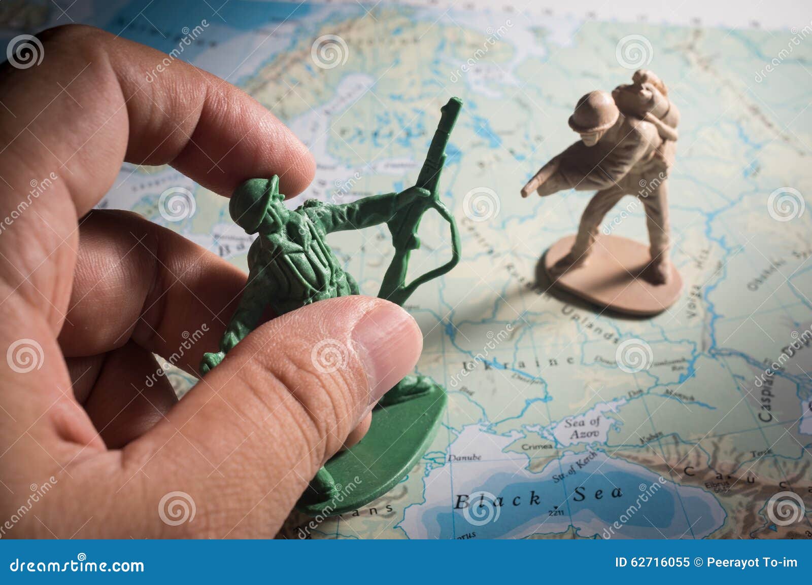 Human Hand with Soldier Toys on Map Stock Image - Image of concept ...