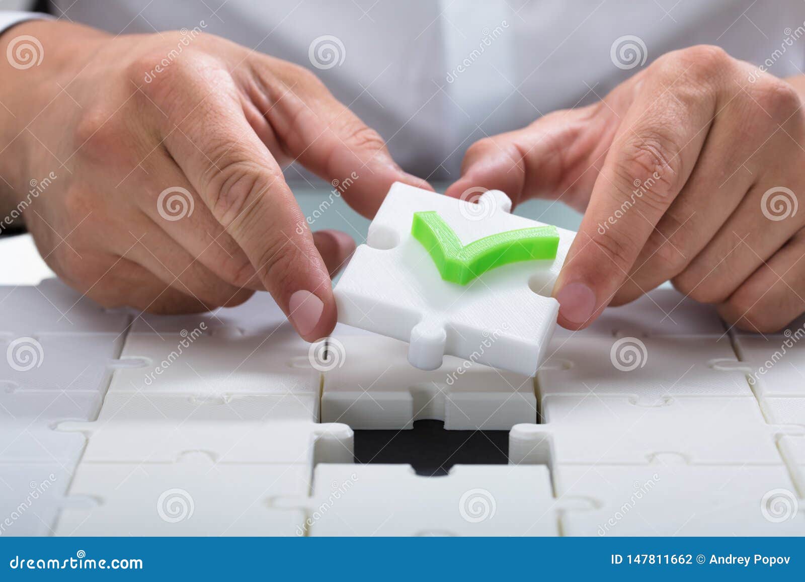 Human Hand Solving Jigsaw Puzzle Stock Photo - Image of abstract, icon ...