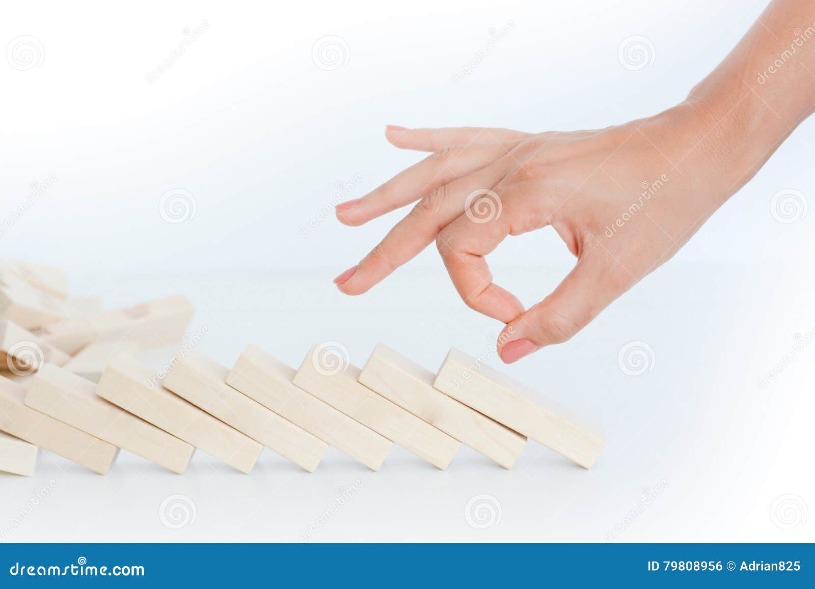 Human Hand Starting a Domino Effect Concept Stock Photo - Image of ...