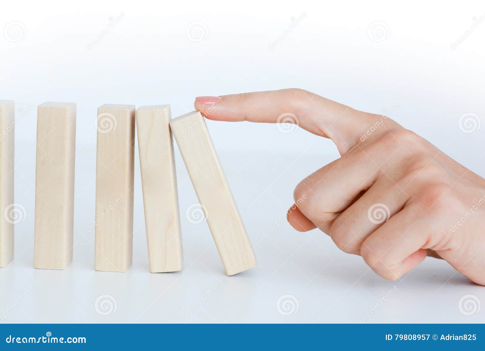 Human Hand Starting a Domino Effect Concept Stock Image - Image of stop ...