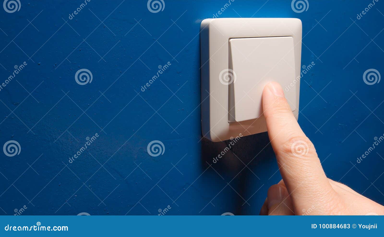 Human Hand Turn Off a Power Button on a Blue Wall - Side View Stock ...