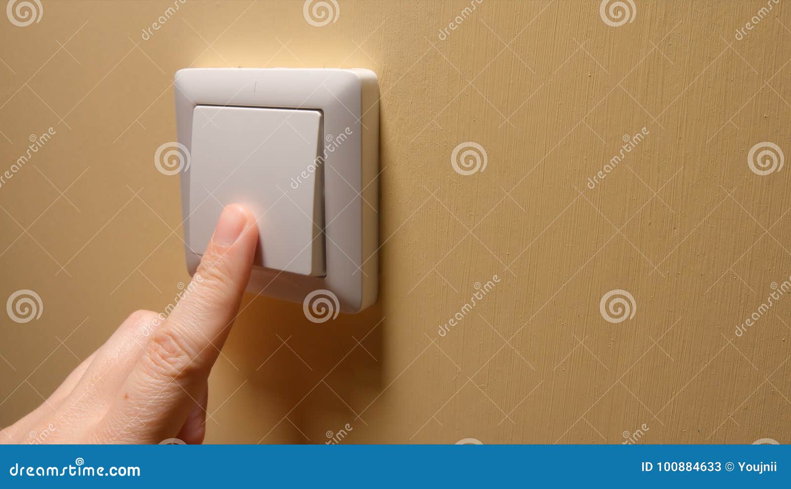 Human Hand Turn Off a Power Button on a Yellow Wall - Side View Stock ...