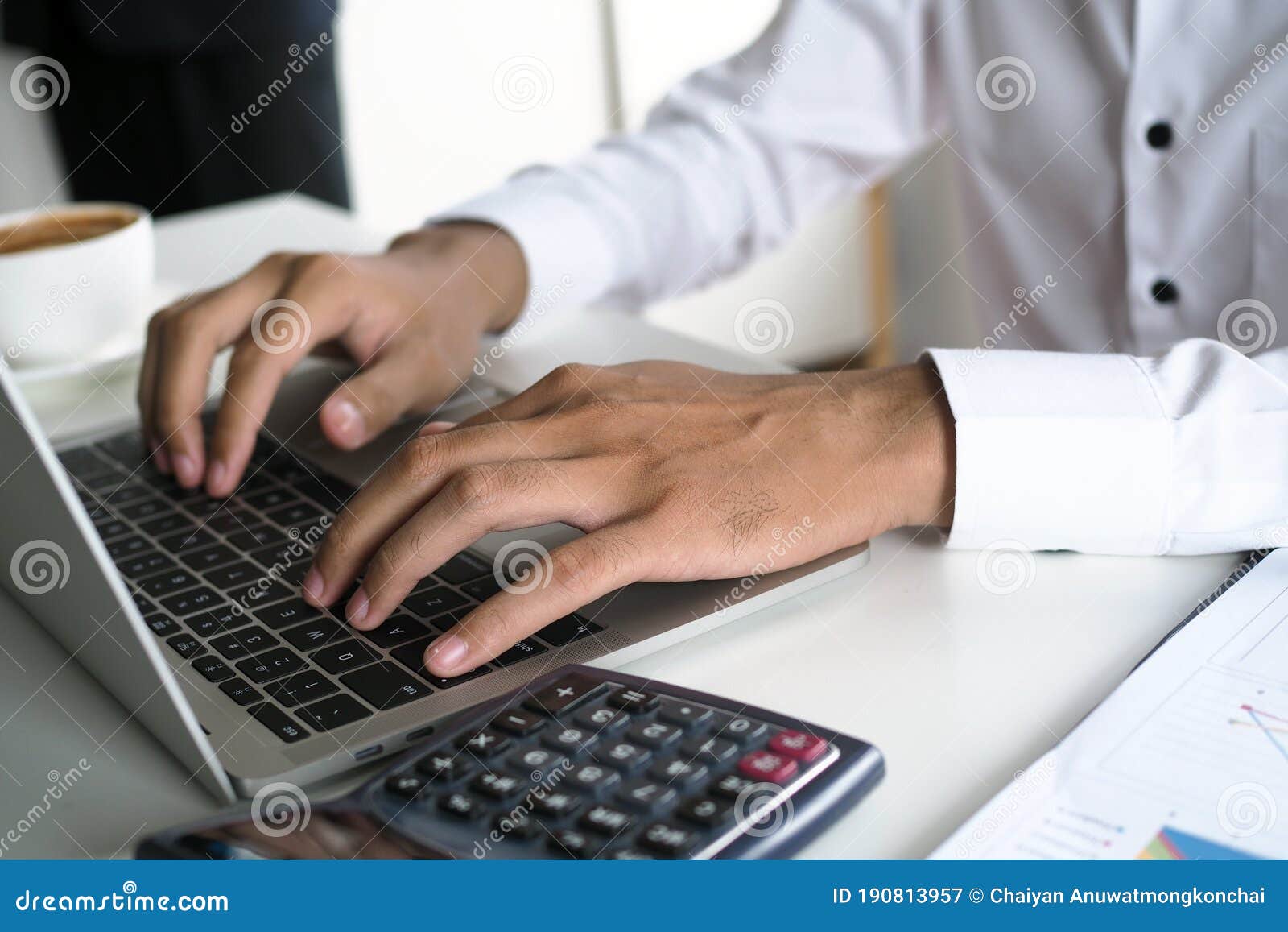 The Human Hand Uses the Keyboard by the Notebook on the Desk. Internet ...