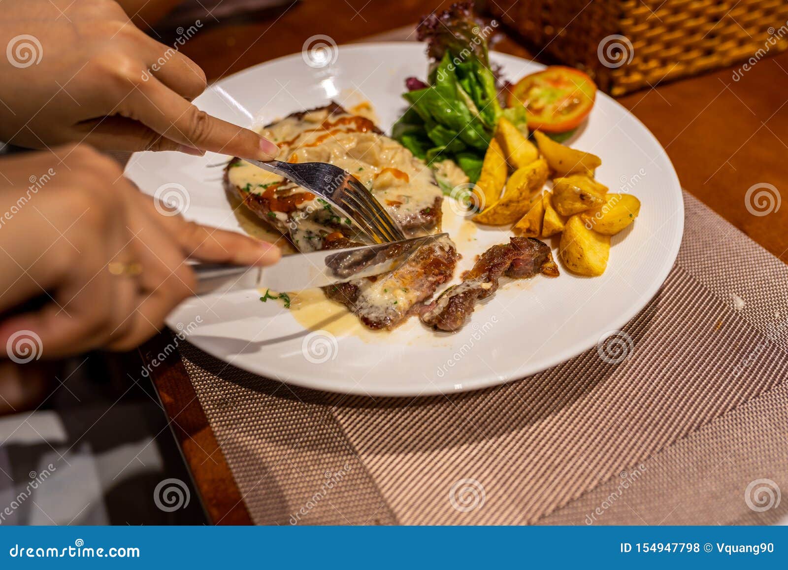 Human Hand Using Knife and Fork To Eat Beef Steak Stock Photo - Image ...