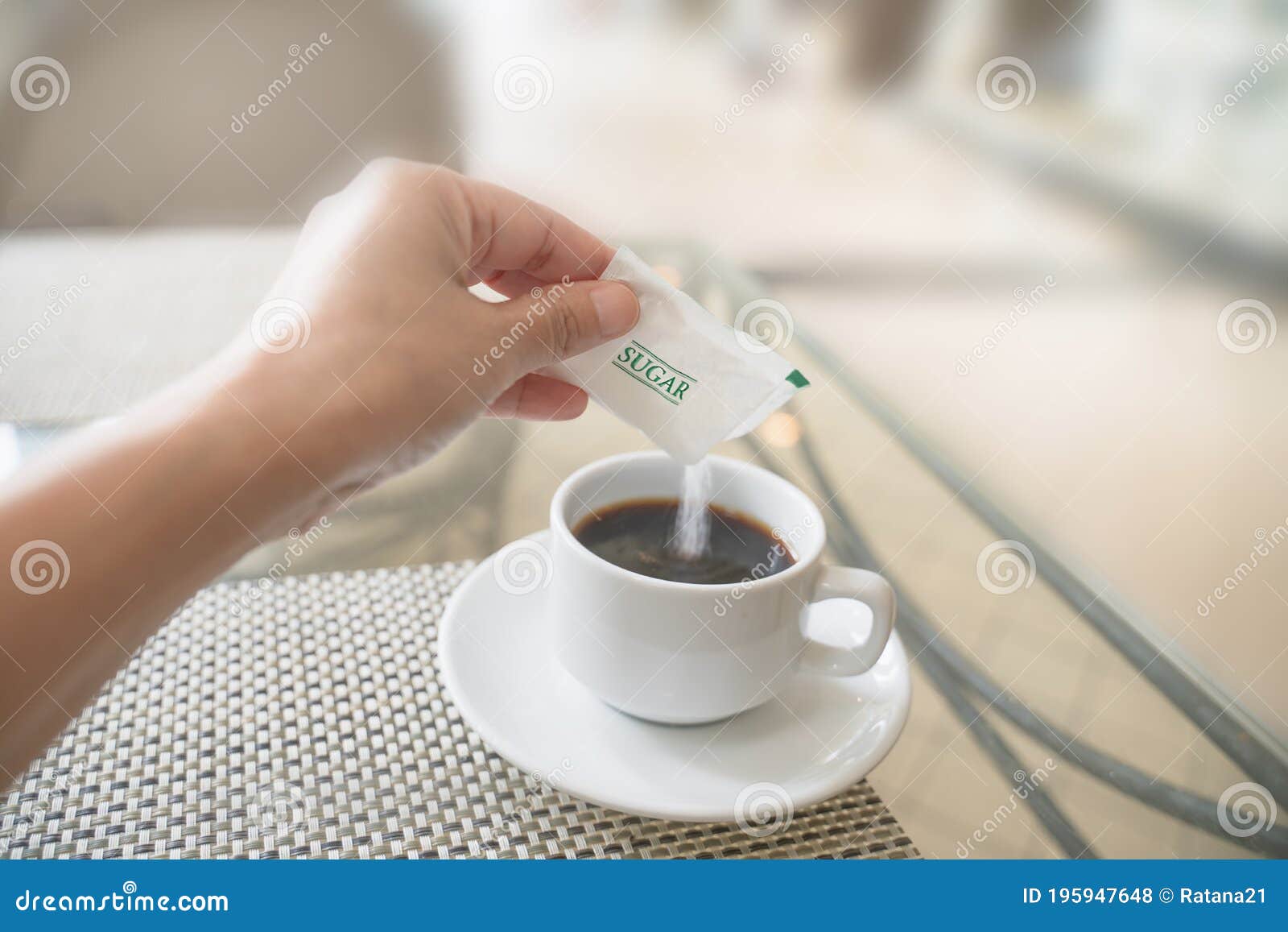Human Hand with White Sugar Packet and Pouring in Hot Black Coffee ...