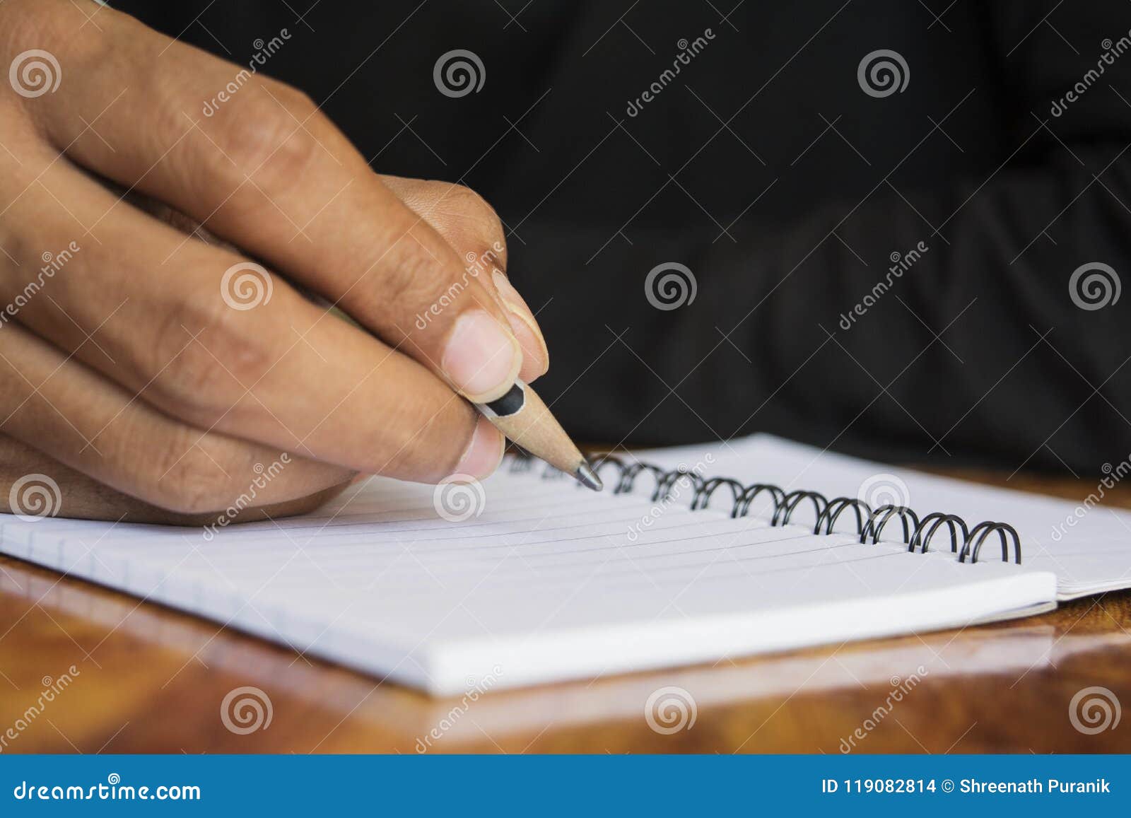 Human hand writing a note stock photo. Image of lead - 119082814
