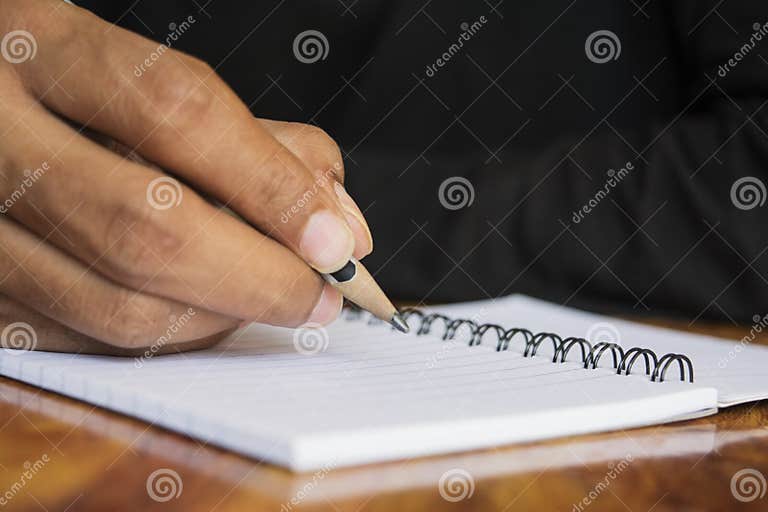 Human hand writing a note stock photo. Image of lead - 119082814