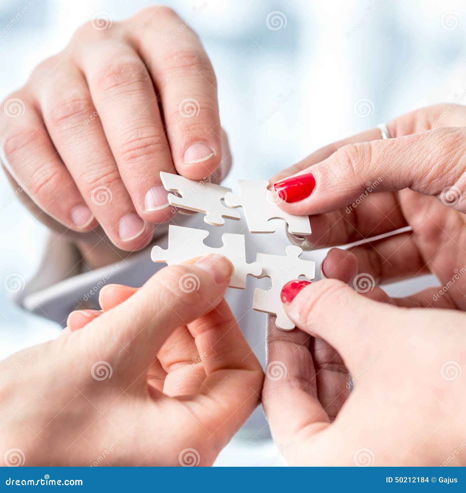 Human Hands Assembling Puzzle Pieces Stock Photo - Image of complete ...