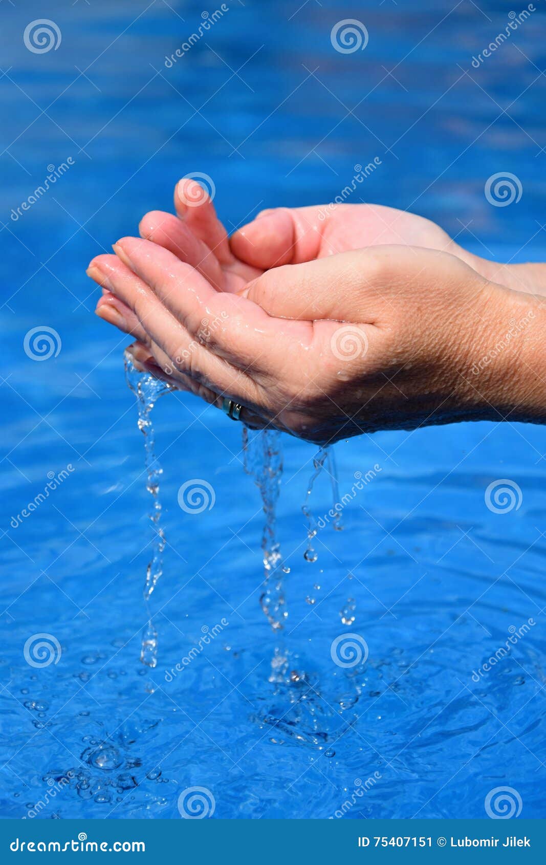 Human Hands with Clear Water on the Blue Background Stock Image - Image ...