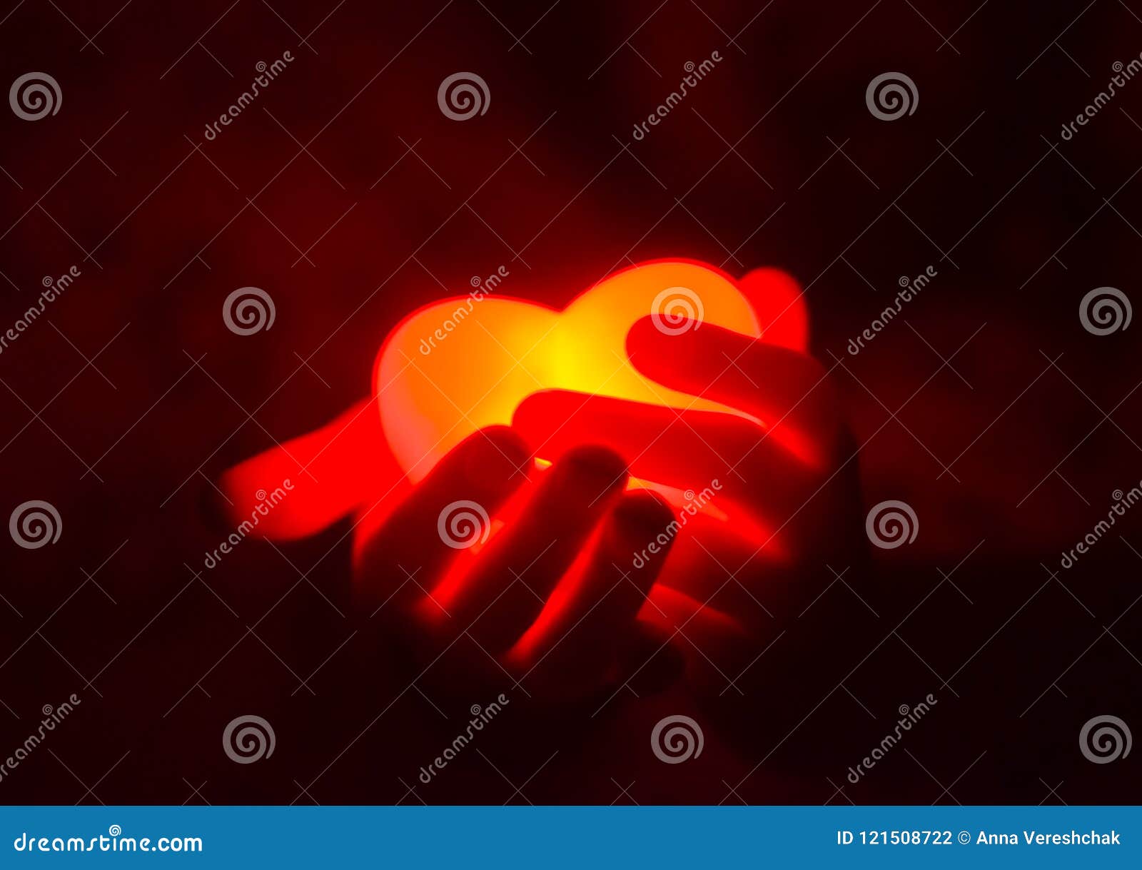 Human Hands Holding Red Glowing Heart in the Dark Stock Photo - Image ...