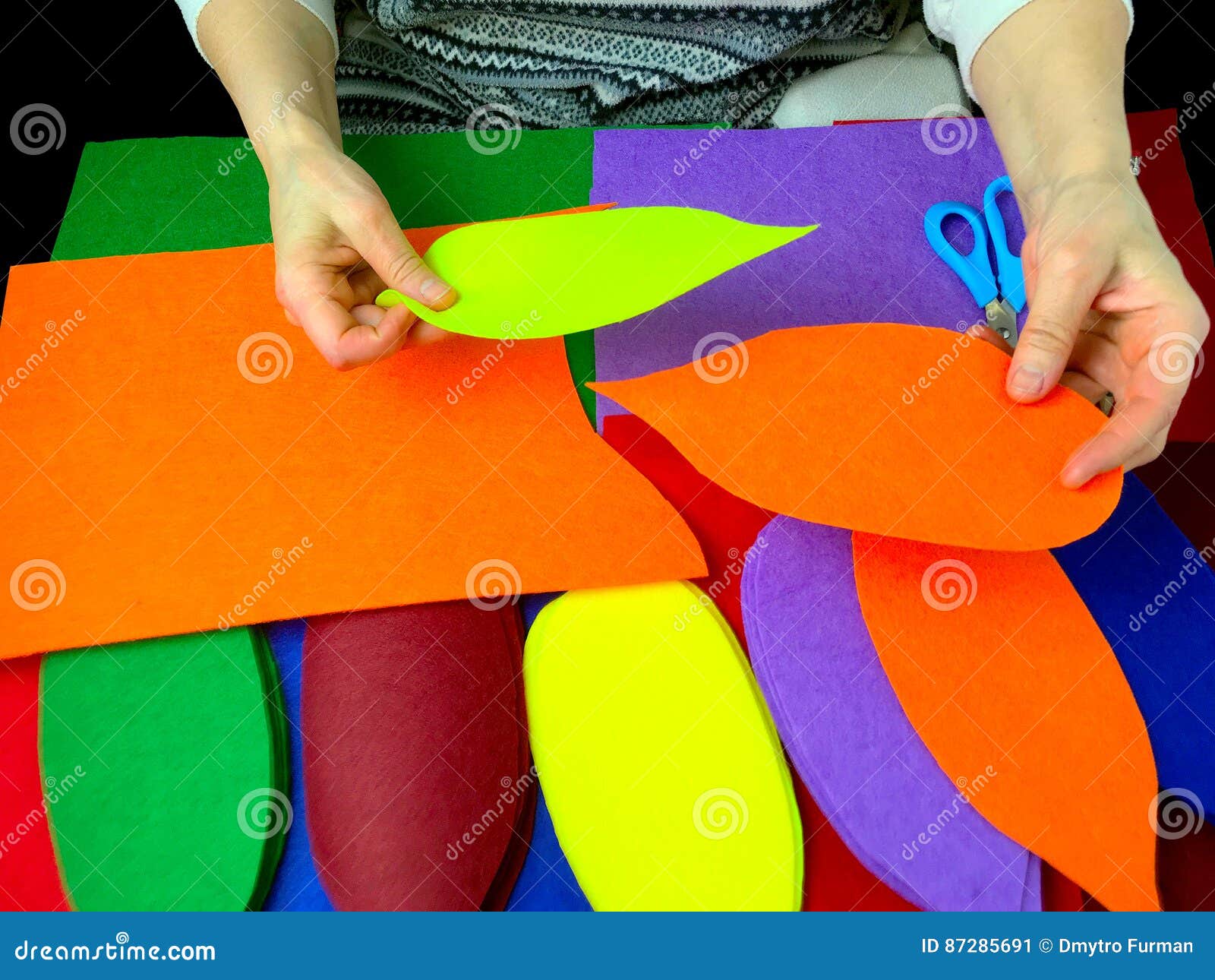 Human Hands that Make Applique Petals of Colored Felt. Stock Image ...