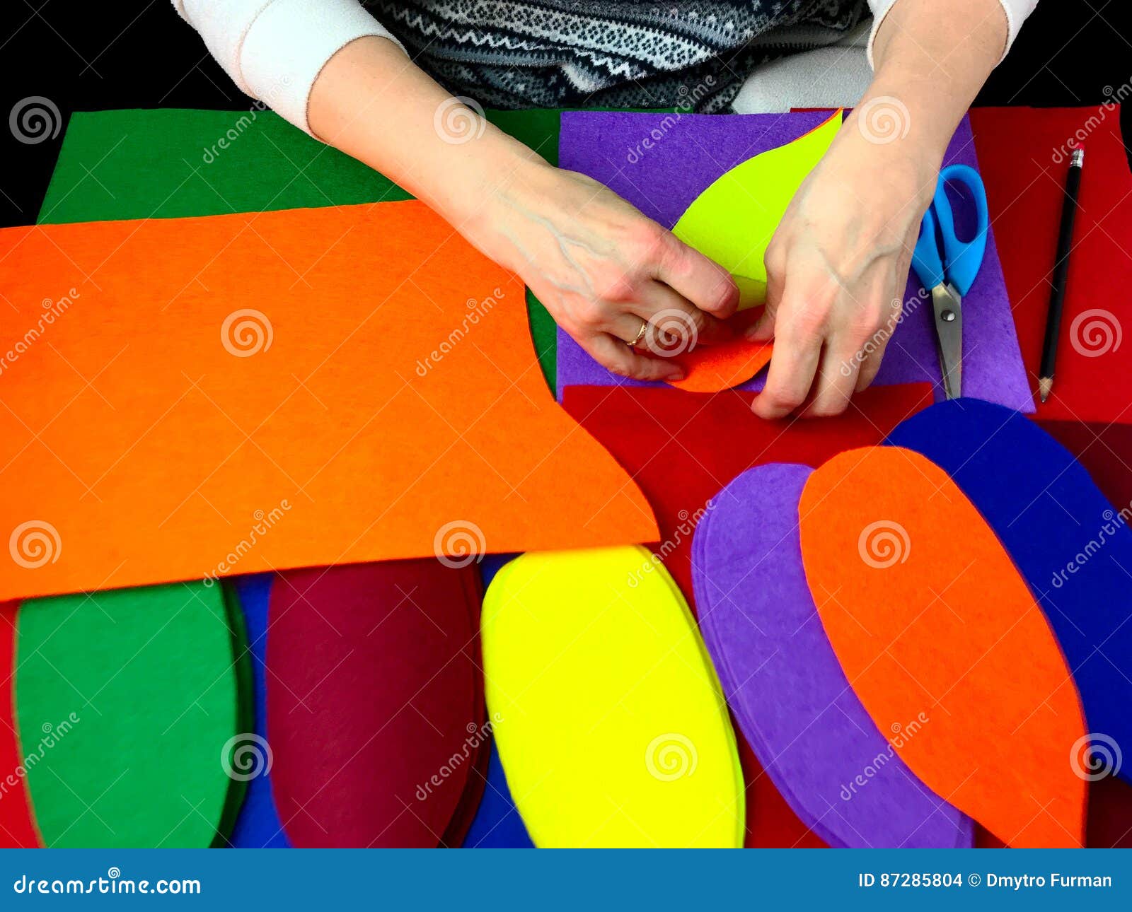 Human Hands that Make Applique Petals of Colored Felt. Stock Photo ...