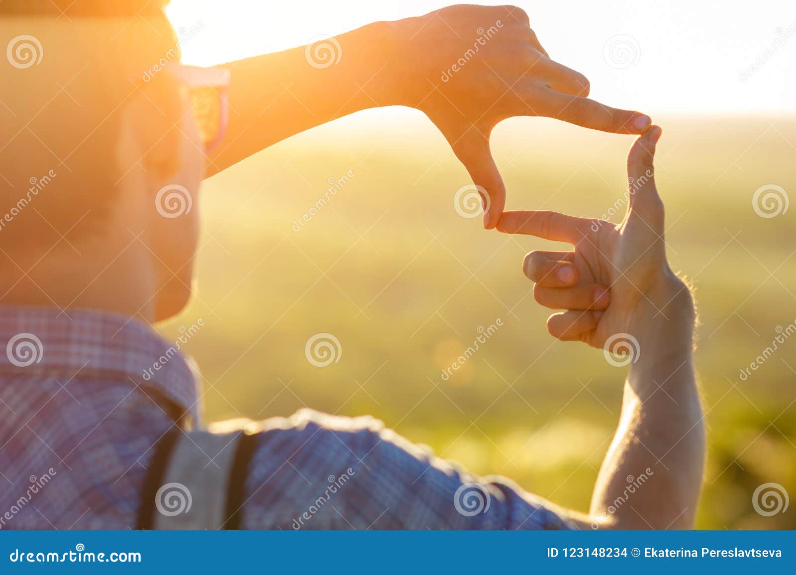 Human Hands Making a Frame Sign Over Sunset Sky Stock Photo - Image of ...