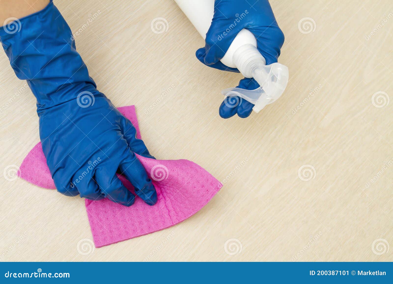 A Human Hands in a Protective Gloves Disinfect the Table Using ...