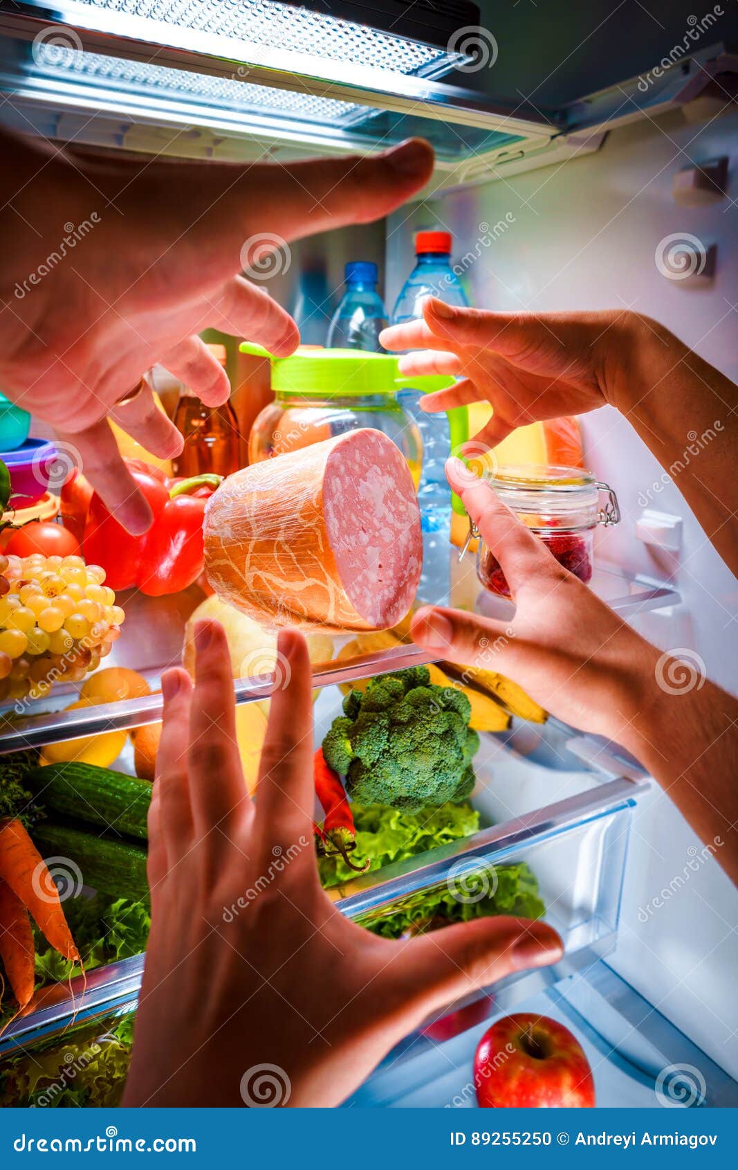 Human Hands Reaching for Food at Night in the Open Refrigerator Stock ...