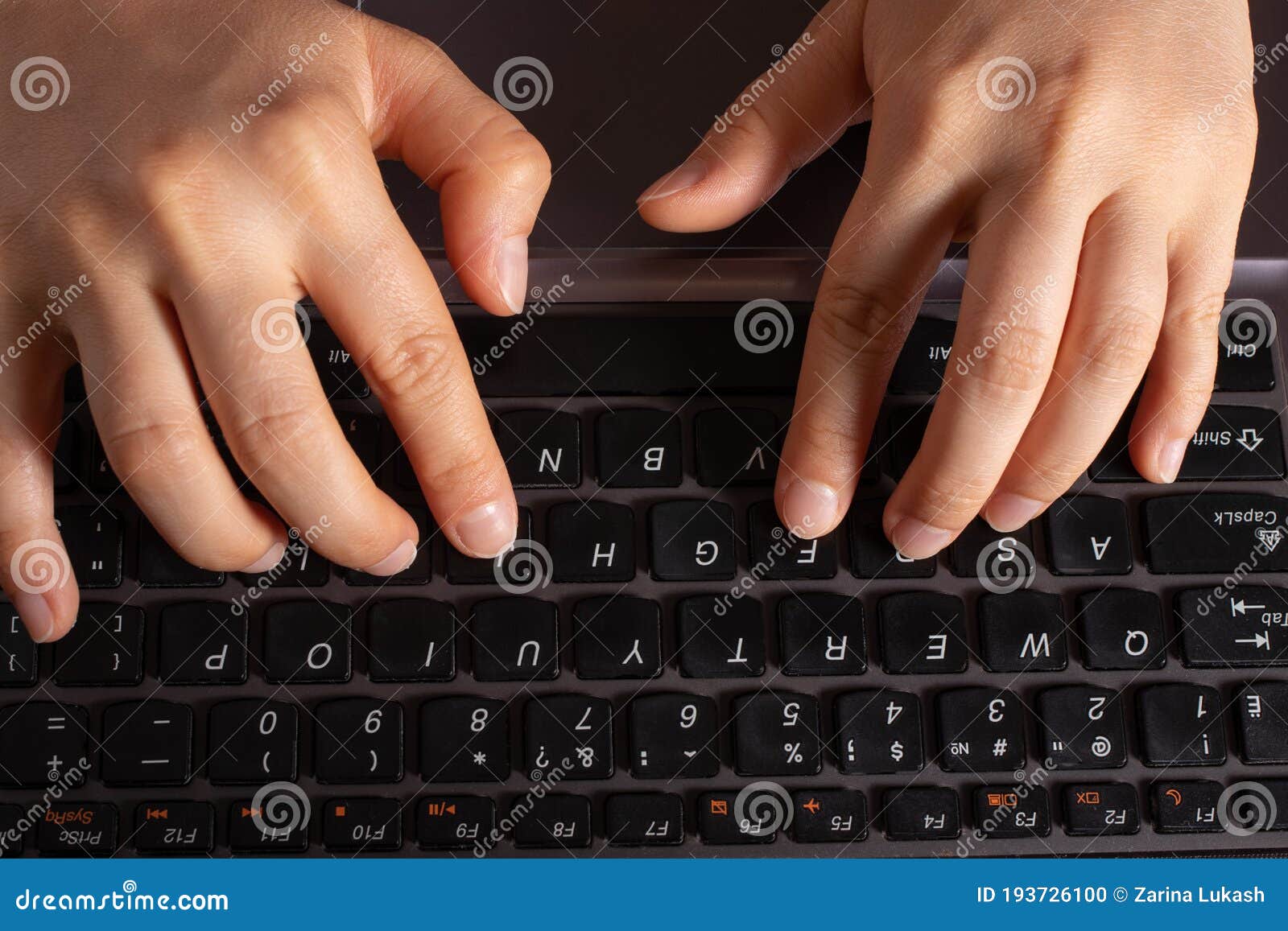 Human Hands are Typing Text on a Black Laptop Keyboard. Typesetter ...