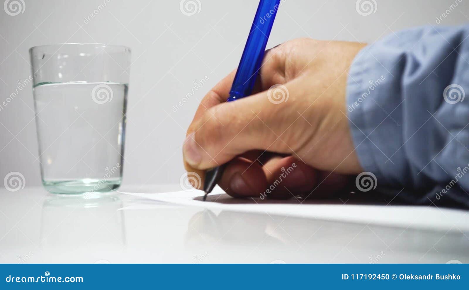Human Hands Write on Sheets of Paper and Drink a Glass of Water ...