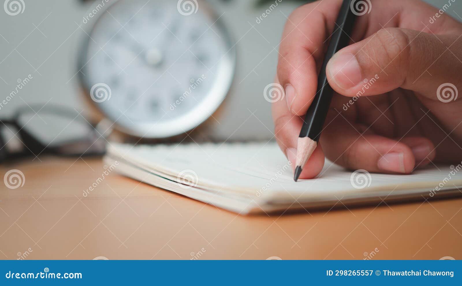 Human Hands Writing Notes with Pencil on Paper on Wooden Table Surface ...