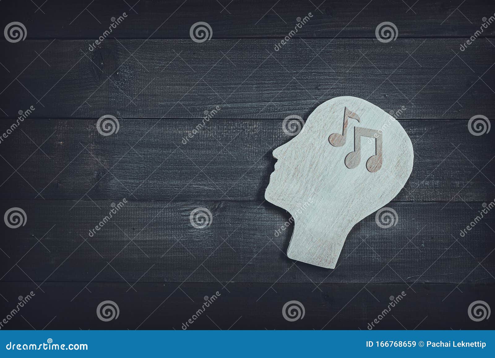 Human Head and Face with Music Note Sign on Wood Table Background ...