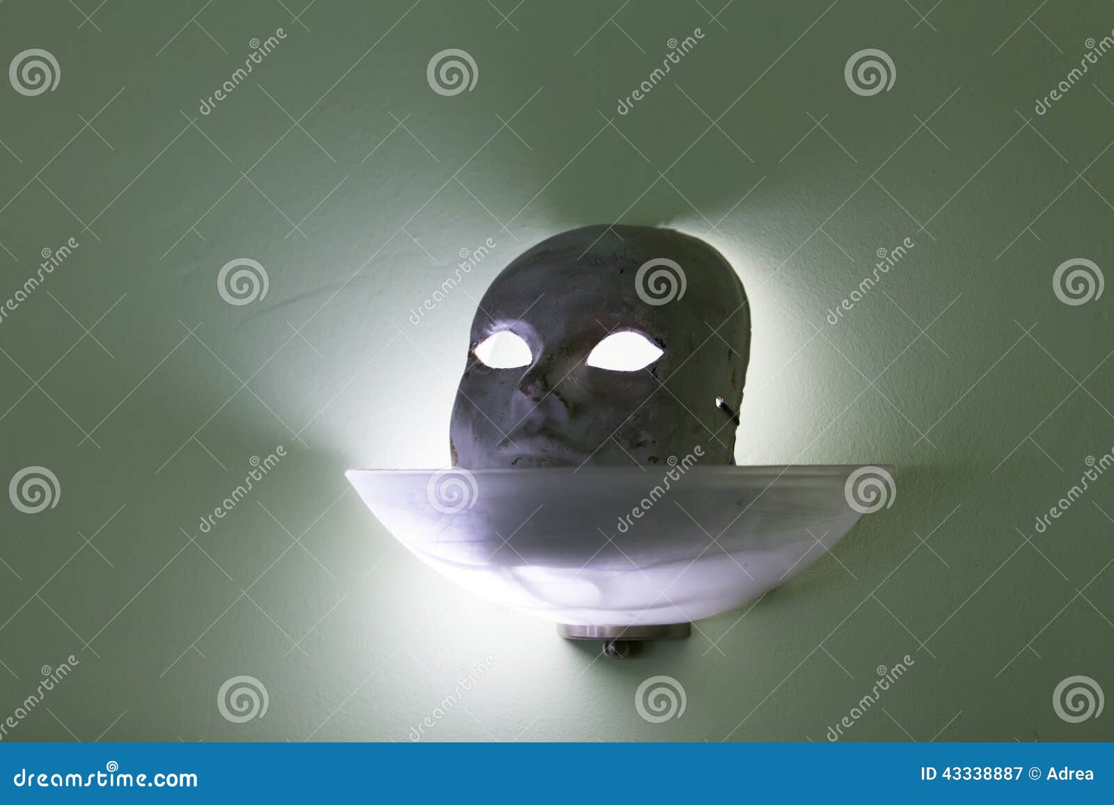 Human Face Mask in Front of an Electric Lamp Stock Image - Image of ...