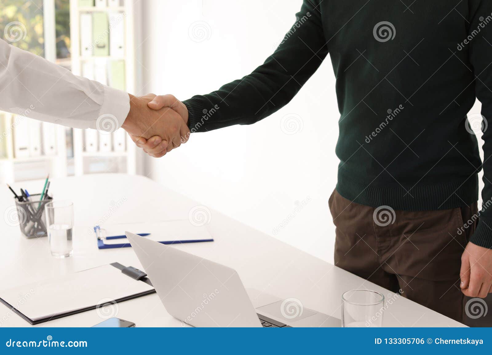 Human Resources Manager Shaking Hands with Applicant during Job ...