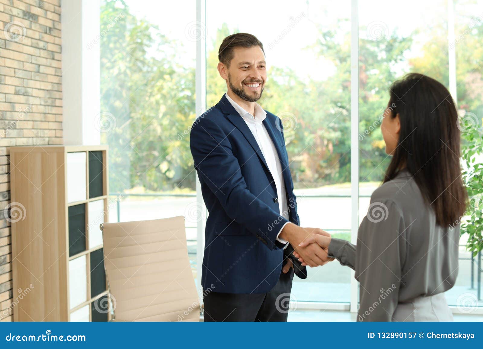 Human Resources Manager Shaking Hands with Applicant during Job ...