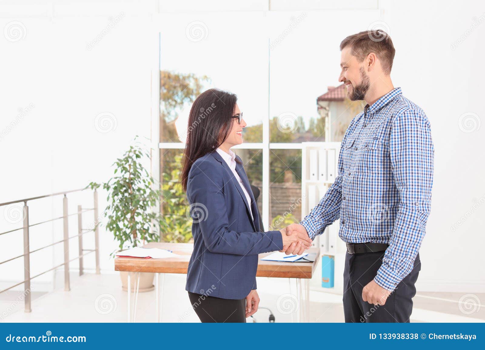 Human Resources Manager Shaking Hands with Applicant during Job ...