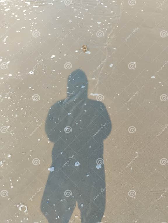 Human shadow on the beach stock photo. Image of human - 287718864