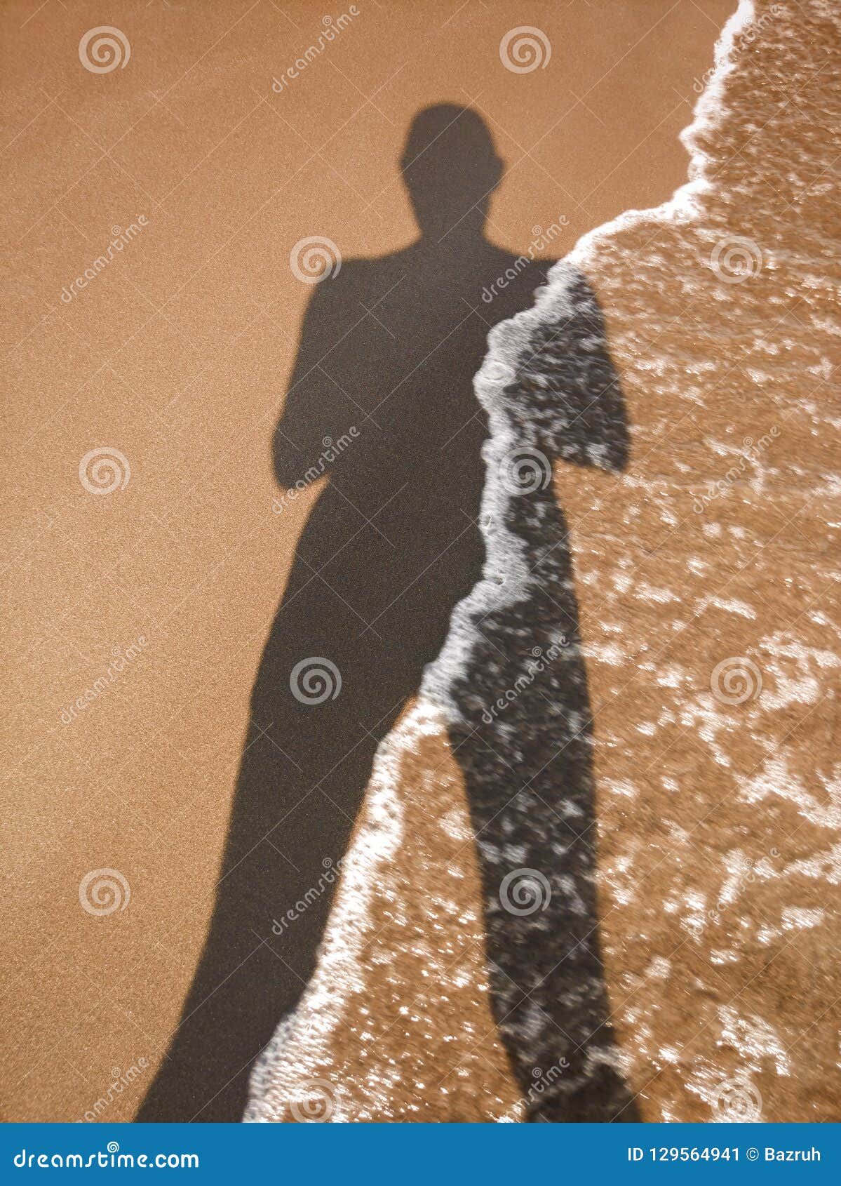 Human shadow on the sand stock image. Image of seaside - 129564941