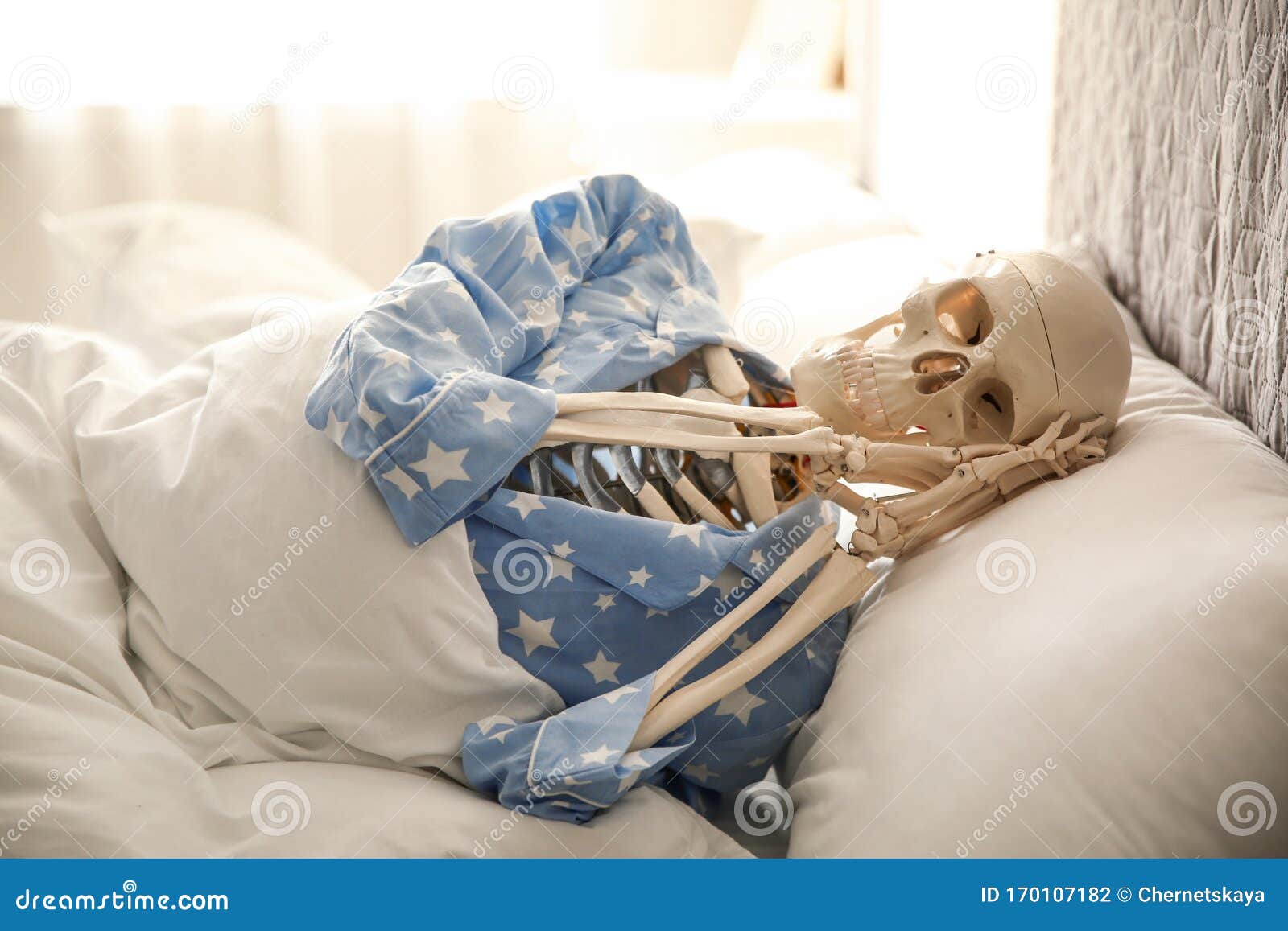 Human Skeleton in Pajamas Lying on Bed Stock Photo - Image of blanket ...