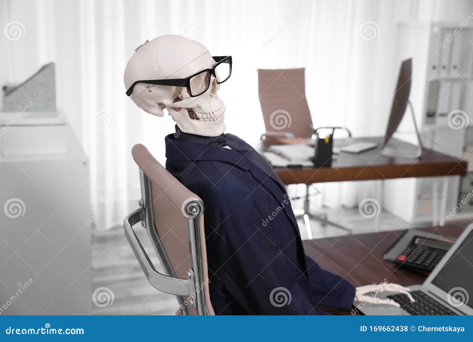 Human Skeleton in Suit Using Laptop at Table Stock Photo - Image of ...